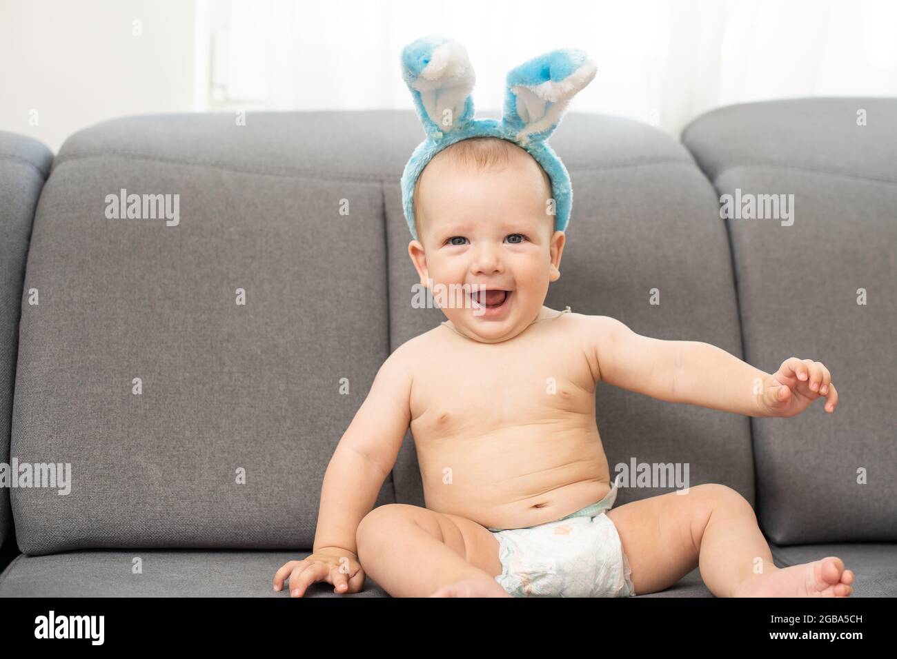 Boy dressed as bunny and Easter eggs Stock Photo - Alamy