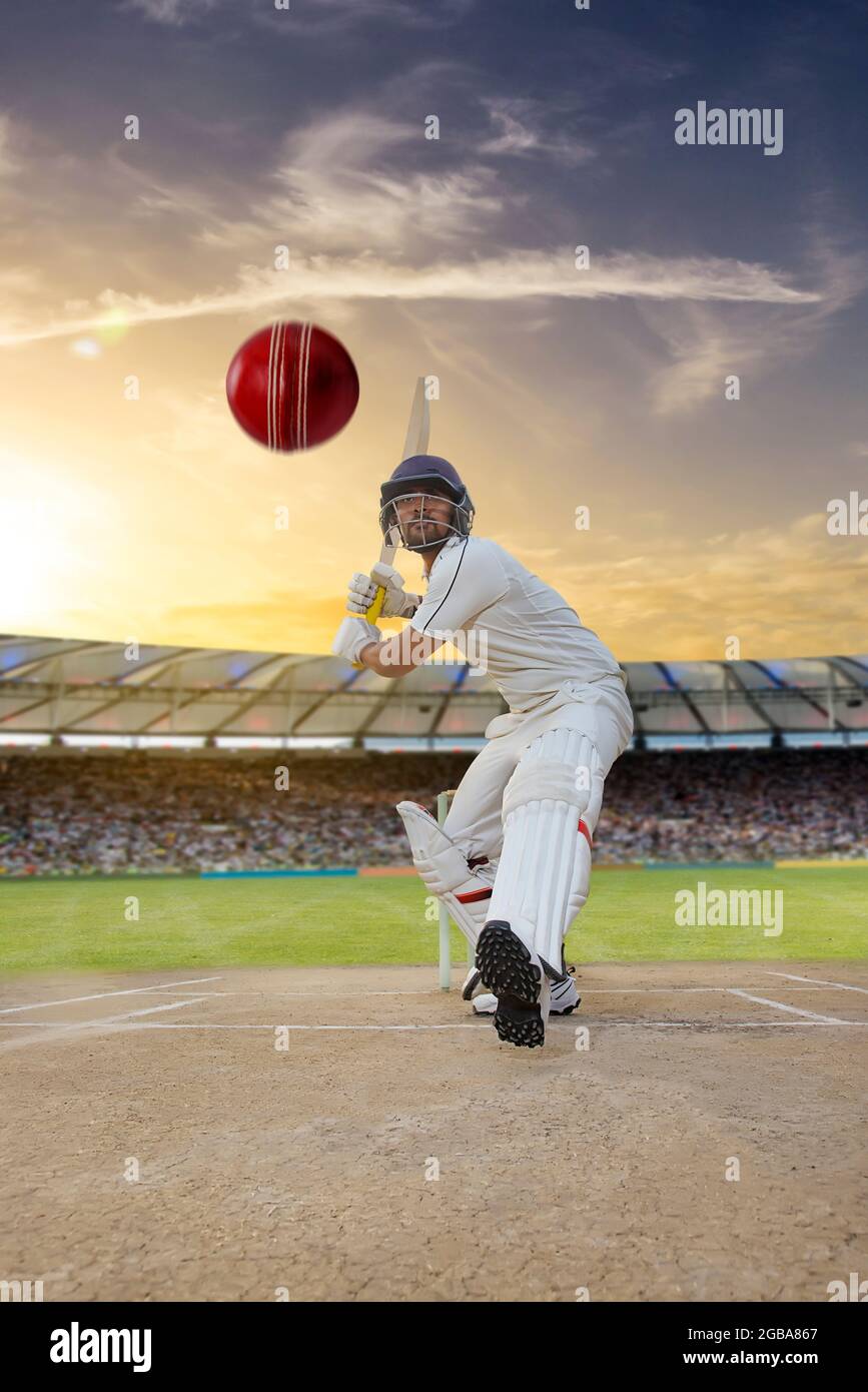 Cricketer batsman hitting a shot during a match on the pitch Stock ...