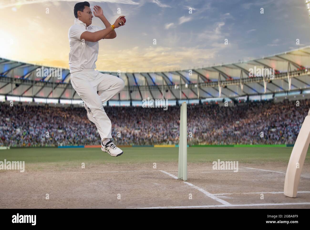 Cricketer, Bowler bowling during a match Stock Photo - Alamy