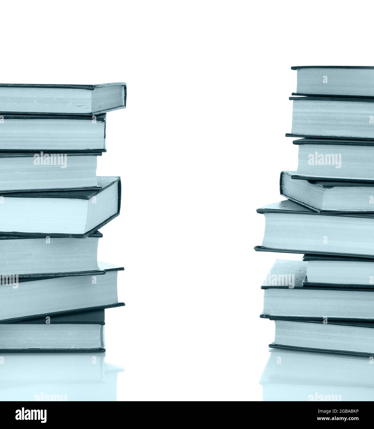 Two stacks of books in grey light isolated on white Stock Photo - Alamy