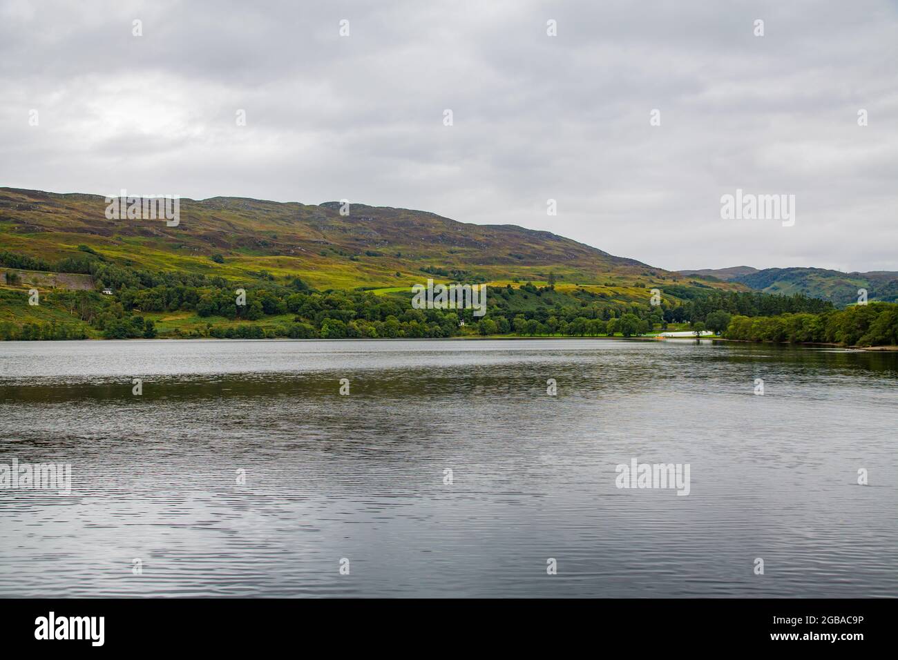 Mysterious Loch Ness with dark waters and picturesque shores lined with ...