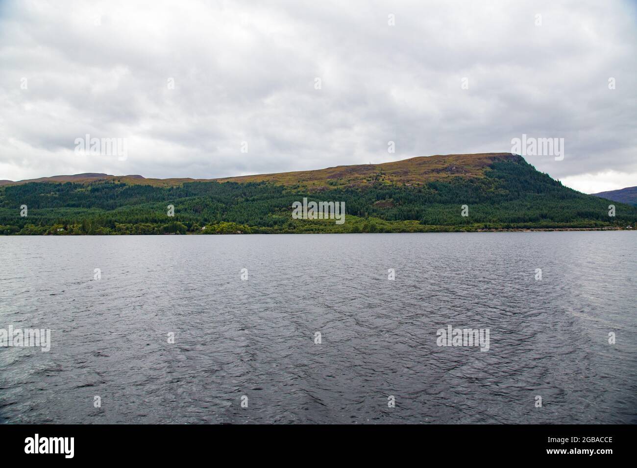 Mysterious Loch Ness with dark waters and picturesque shores lined with ...