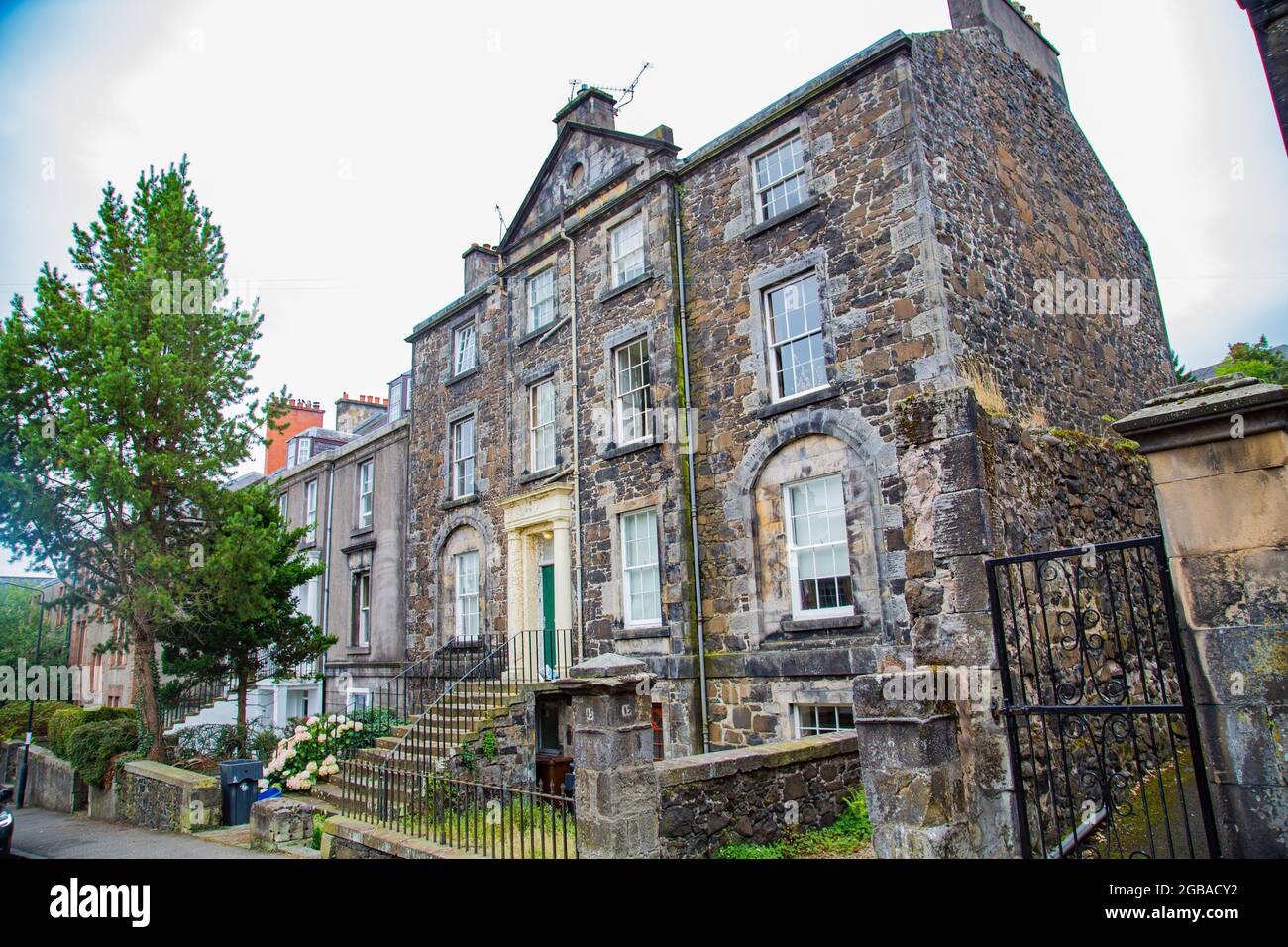 Typical three storey stone Scottish house with large wooden windows ...