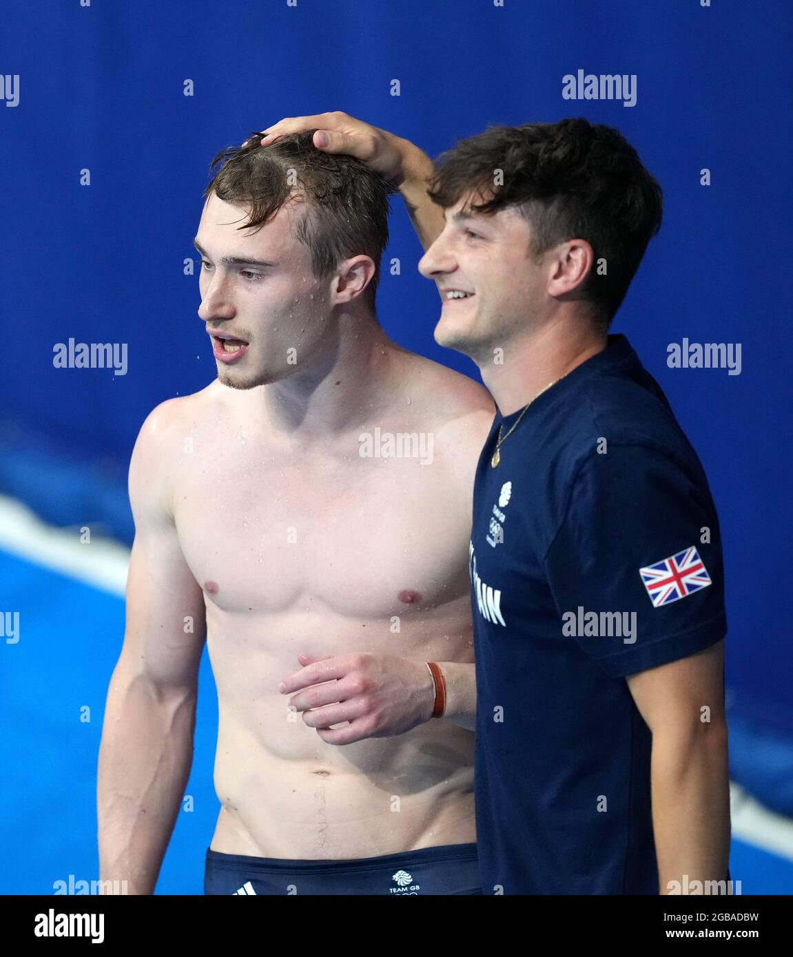 Great Britain's Jack Laugher (left) and coach Adam Smallwood react ...