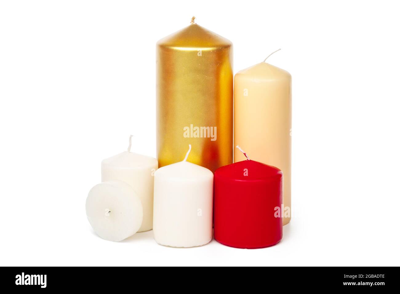 Colored candles of different size on white background Stock Photo - Alamy