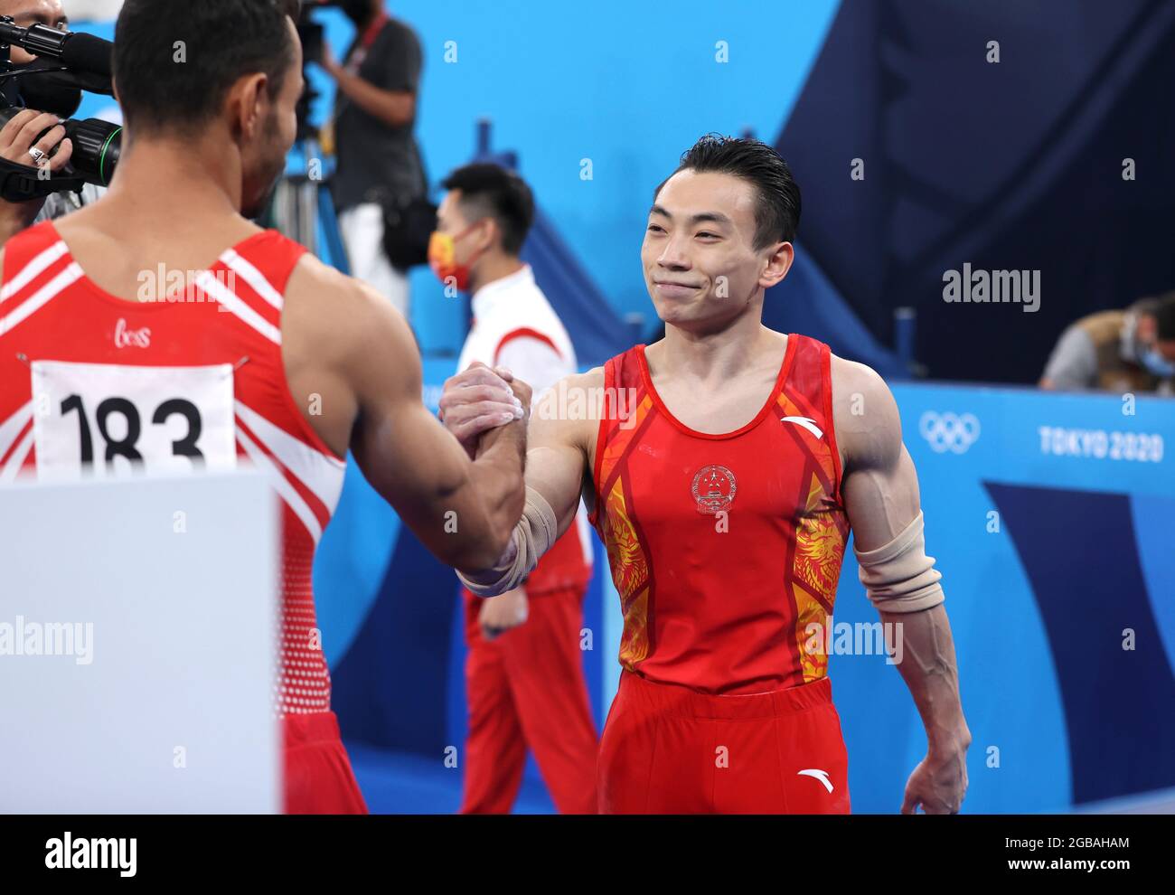 Tokyo, Japan. 3rd Aug, 2021. Zou Jingyuan (R) of China greets Ferhat ...