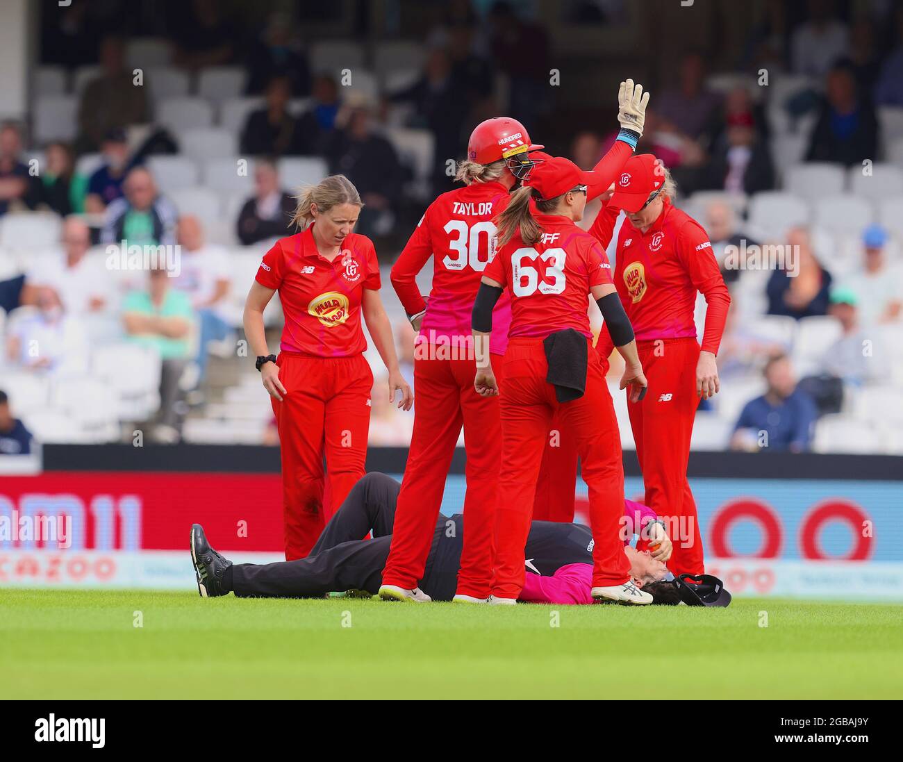 2 August, 2021. London, UK. Umpire Sue Redfern takes a fall as the Oval ...