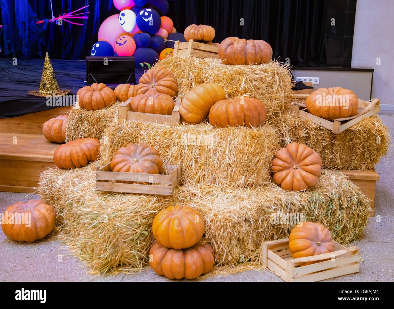 Halloween pumpkins laying on the hay Stock Photo - Alamy