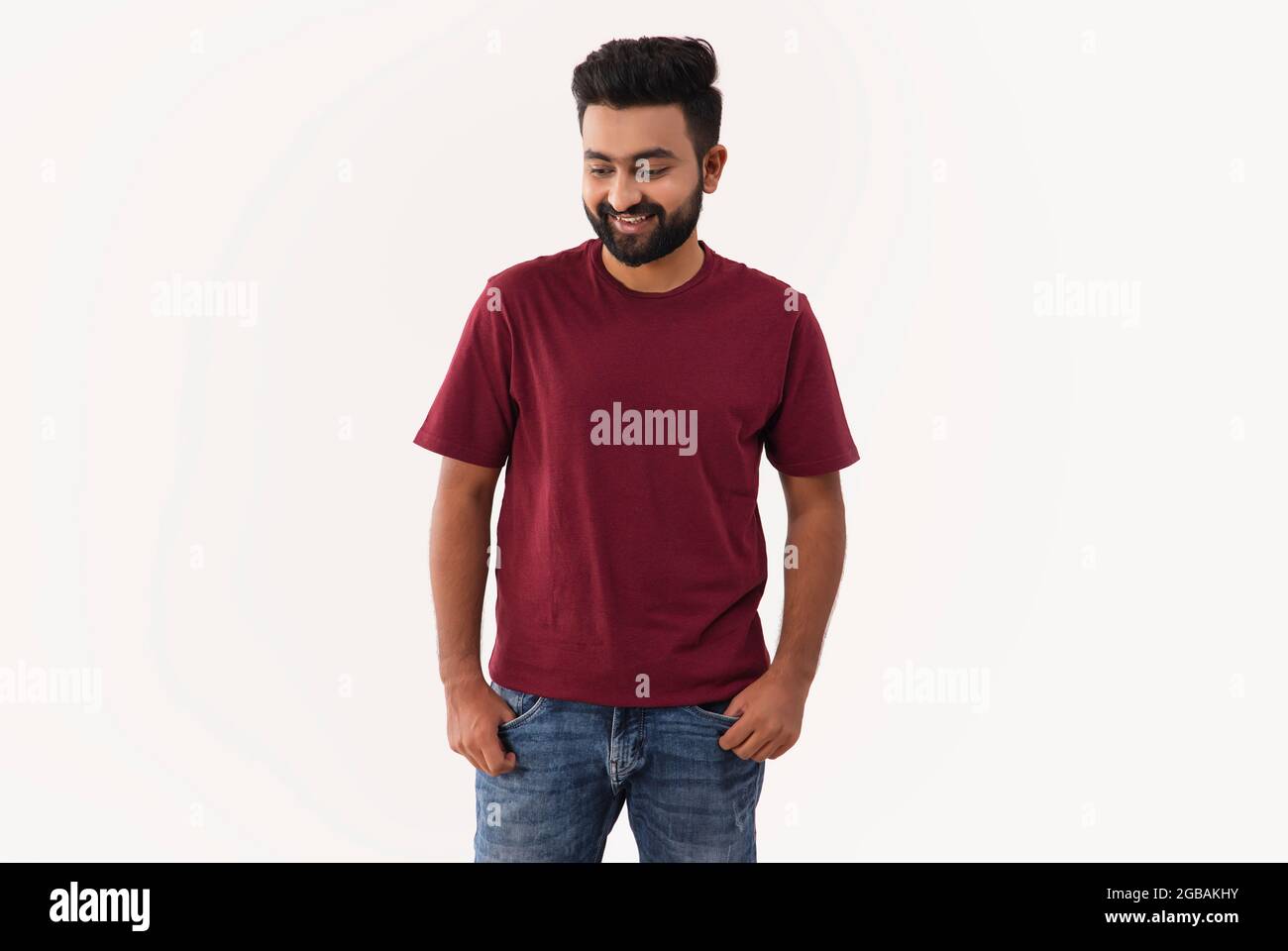 A BEARDED YOUNG MAN STANDING AND SMILING Stock Photo - Alamy