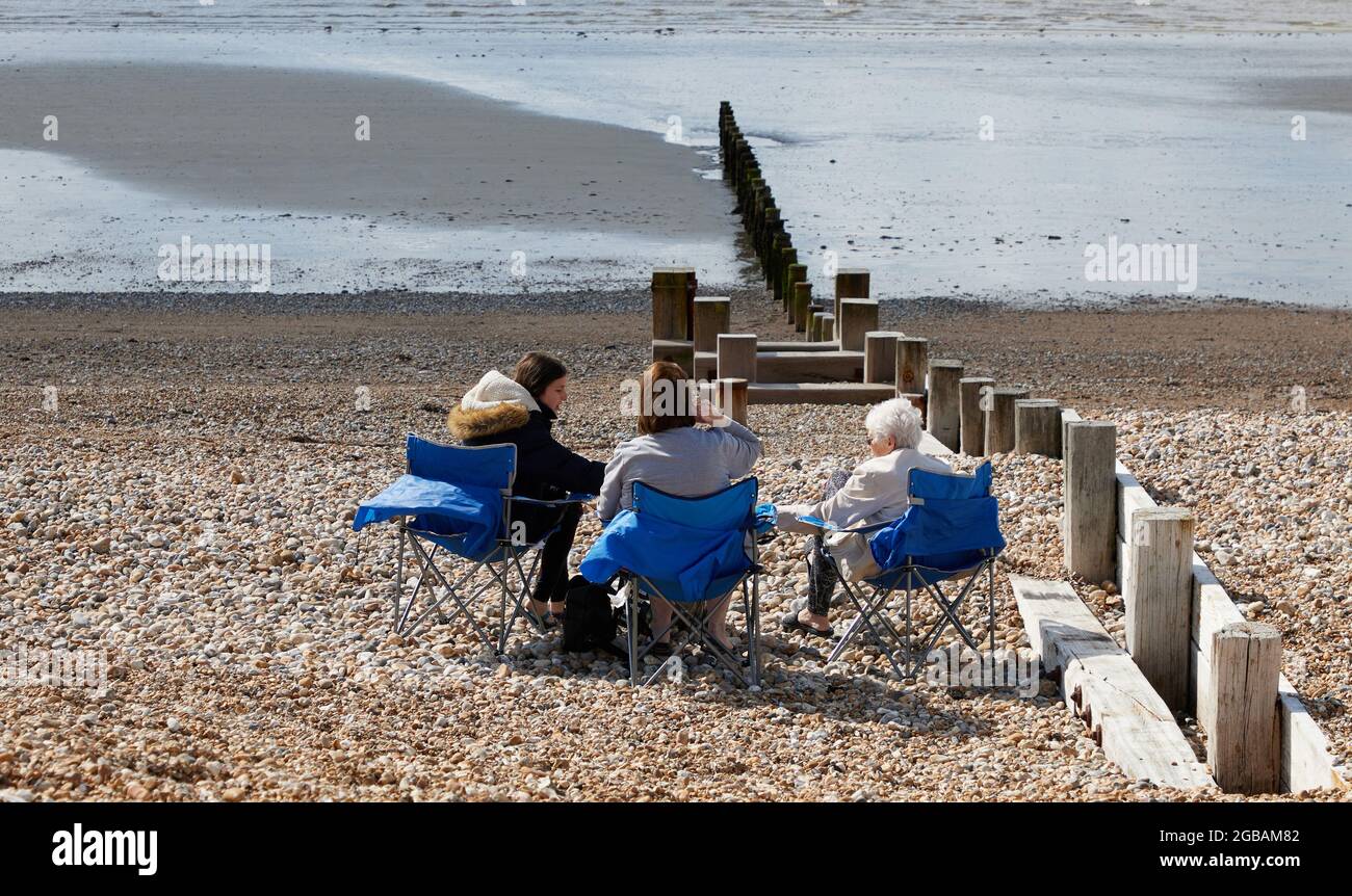 Three generations of the same damily seen on the beach Stock Photo - Alamy