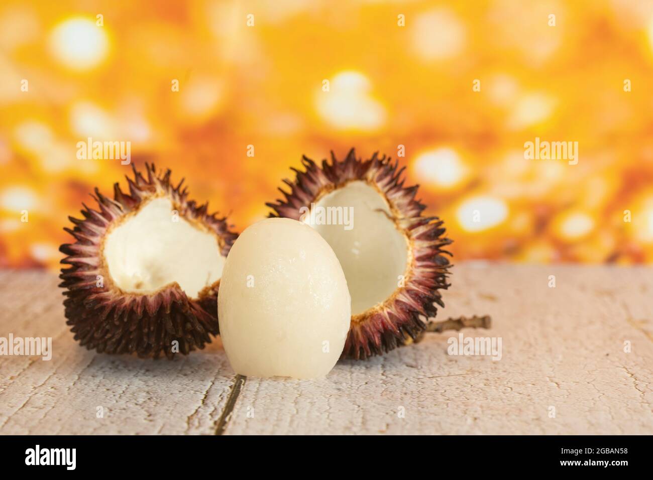 Local fruits called pulasan that has been opened and the fruit inside ...