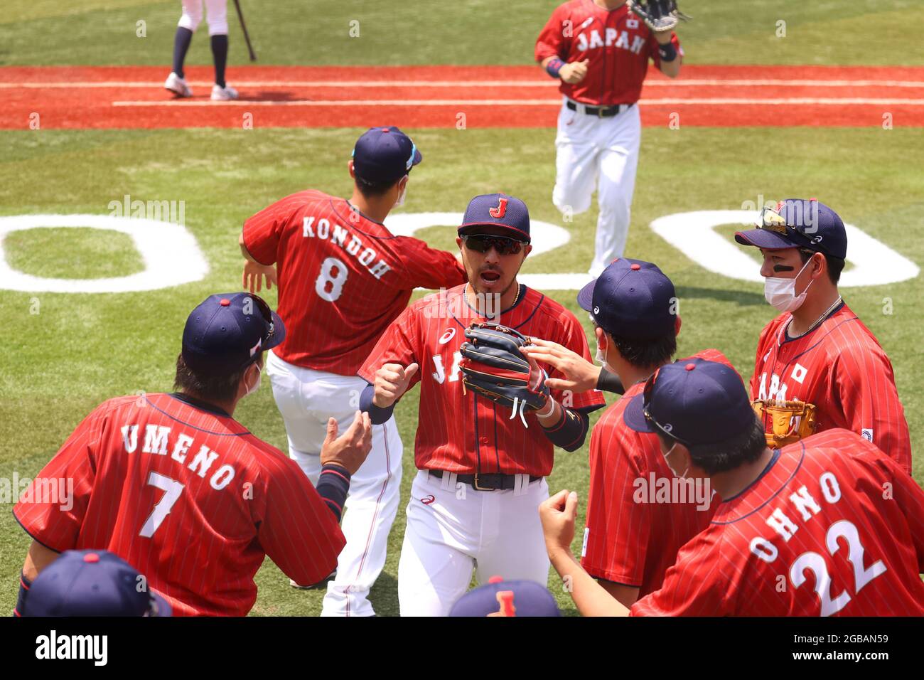 Japan players high-five each other in front of the bench, JULY 31, 2021 ...