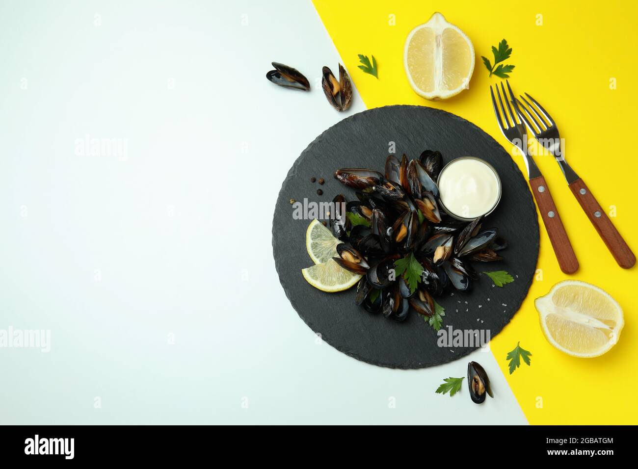 Concept of delicious food with mussels on two tone background Stock ...