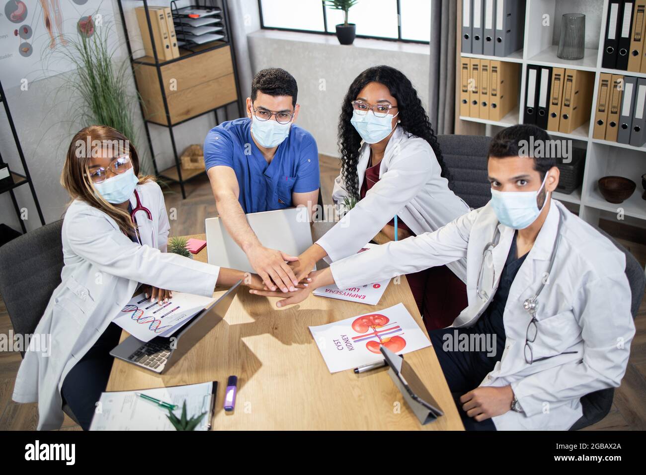 Success, teamwork concept. Team of multiracial scientists doctors in ...