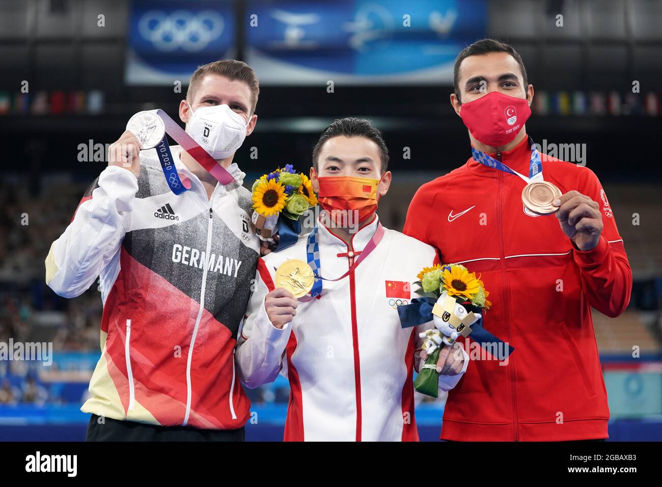 Tokyo, Japan. 3rd Aug, 2021. Zou Jingyuan (C) of China, Lukas Dauser (L ...