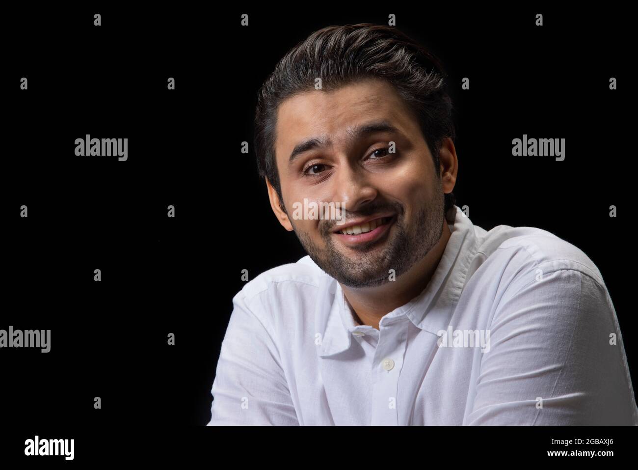 A portrait of a happy young man looking into camera Stock Photo - Alamy