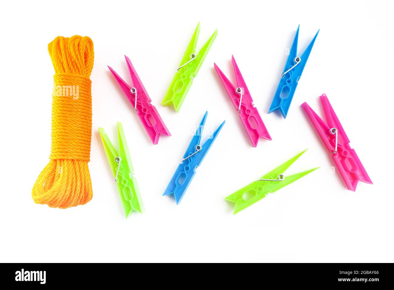 clothespins and reeled clothesline texture on an isolated white ...