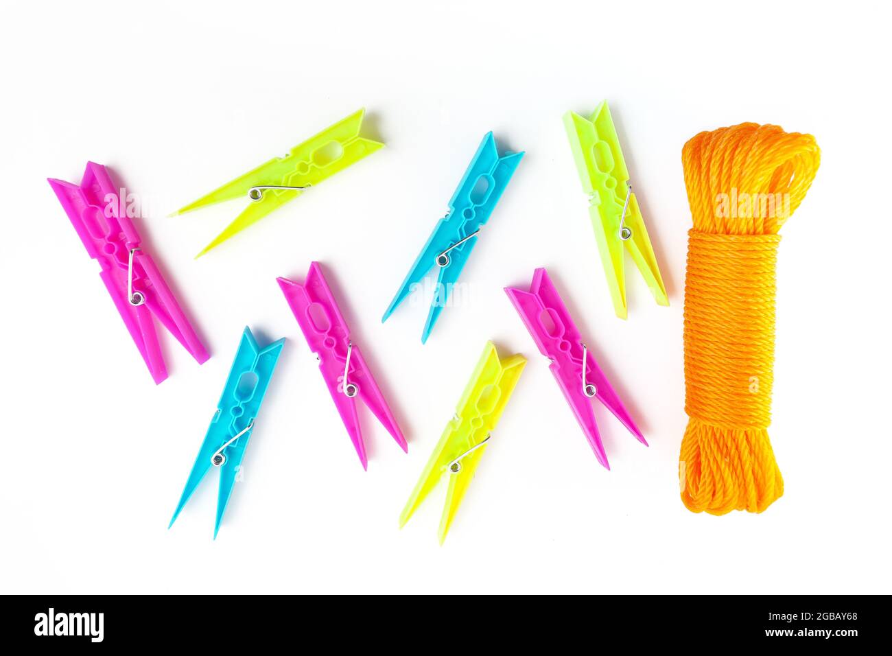 clothespins and reeled clothesline texture on an isolated white ...