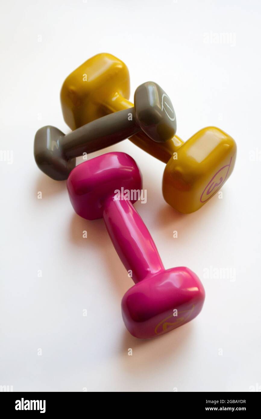 Colorful dumbbells set isolated on white background Stock Photo - Alamy