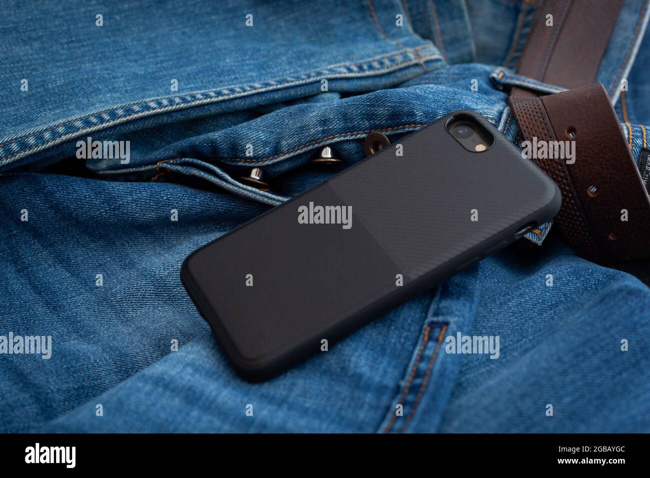 multi-colored mobile phone case on a denim background Stock Photo - Alamy