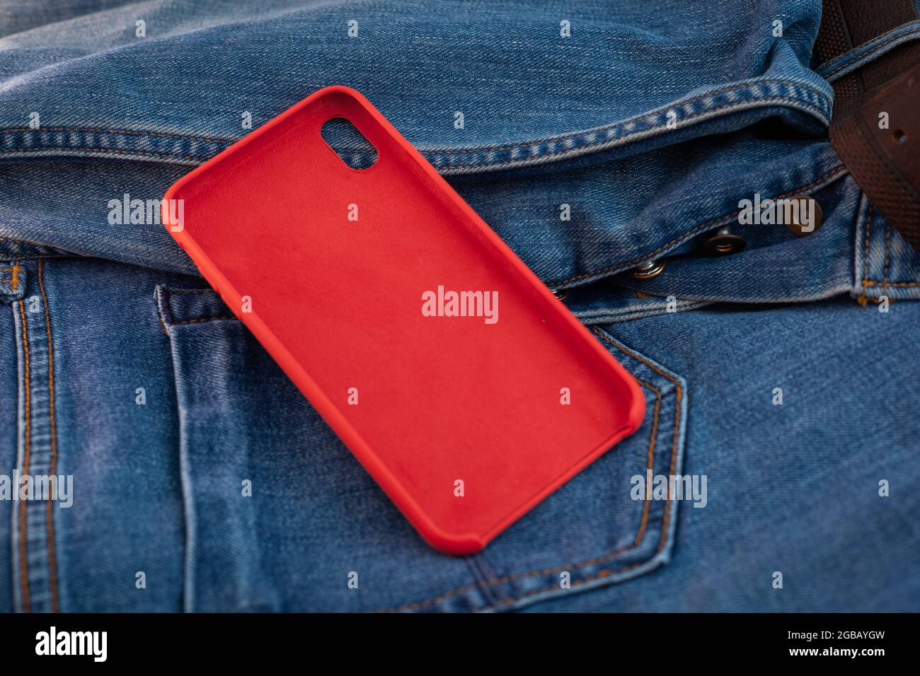 multi-colored mobile phone case on a denim background Stock Photo - Alamy