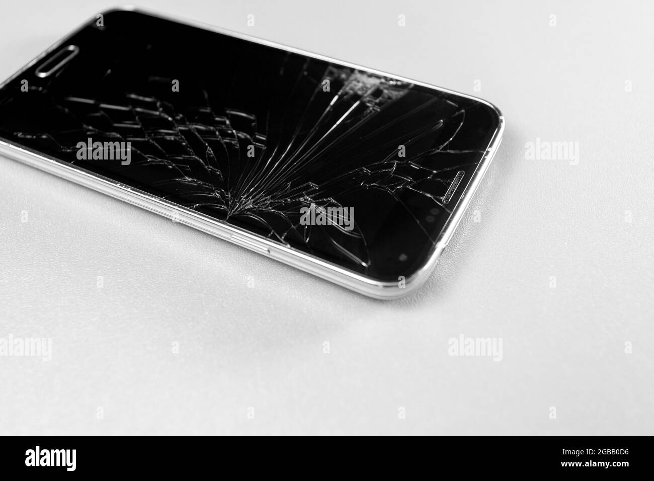 broken mobile phone display on a white background Stock Photo - Alamy
