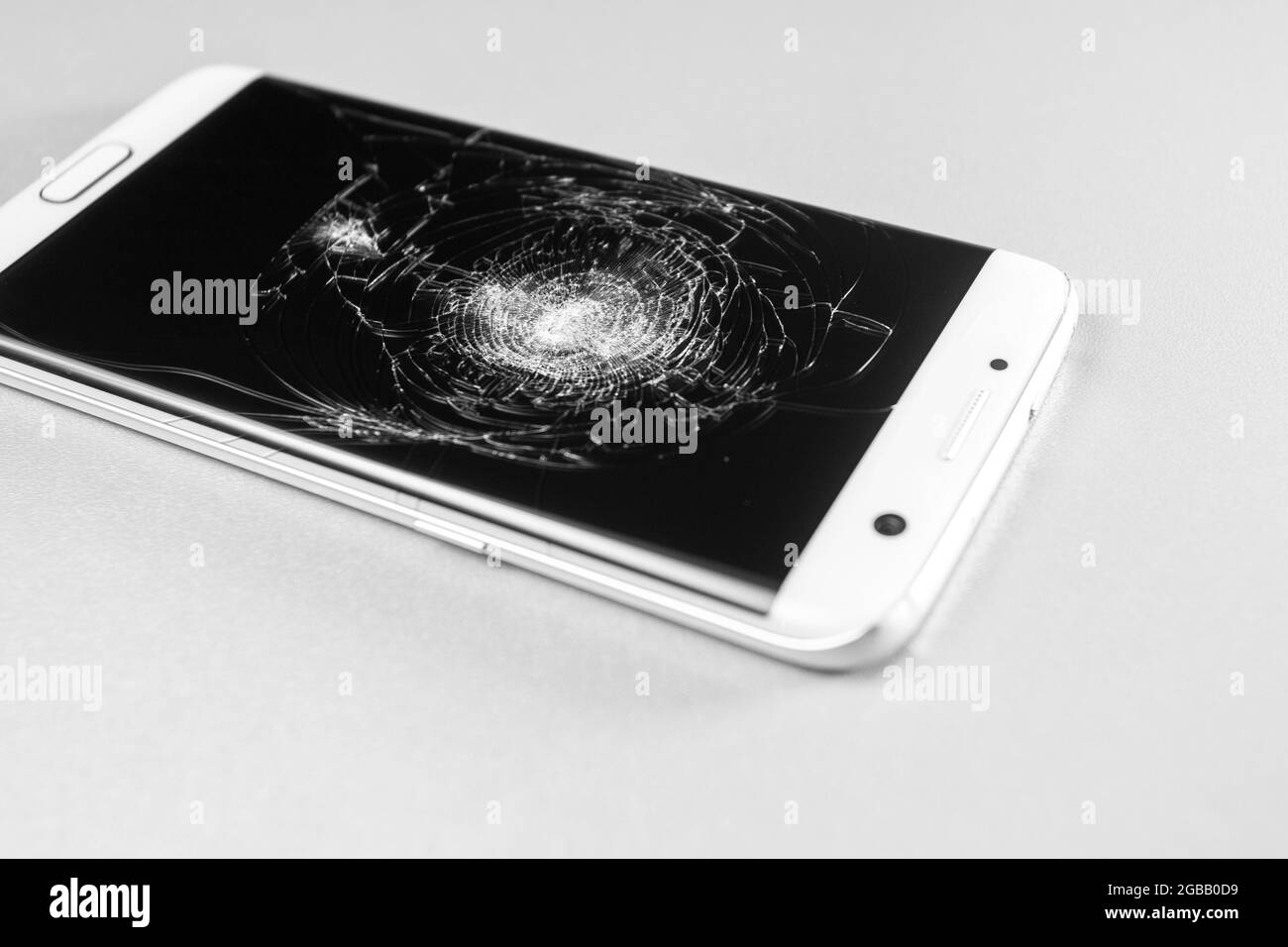 broken mobile phone display on a white background Stock Photo - Alamy