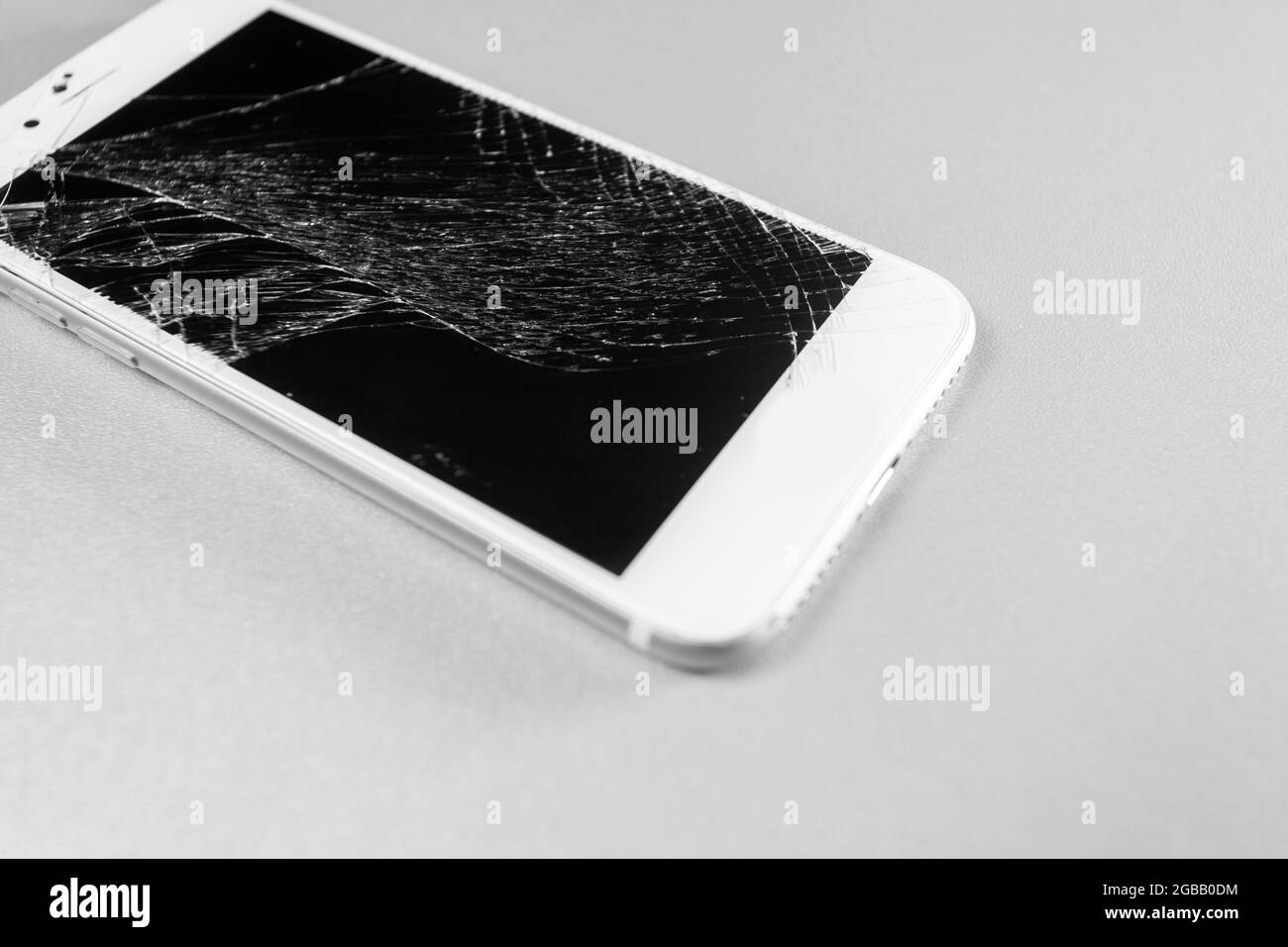 broken mobile phone display on a white background Stock Photo - Alamy