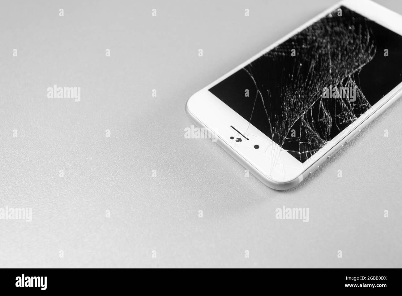 broken mobile phone display on a white background Stock Photo - Alamy