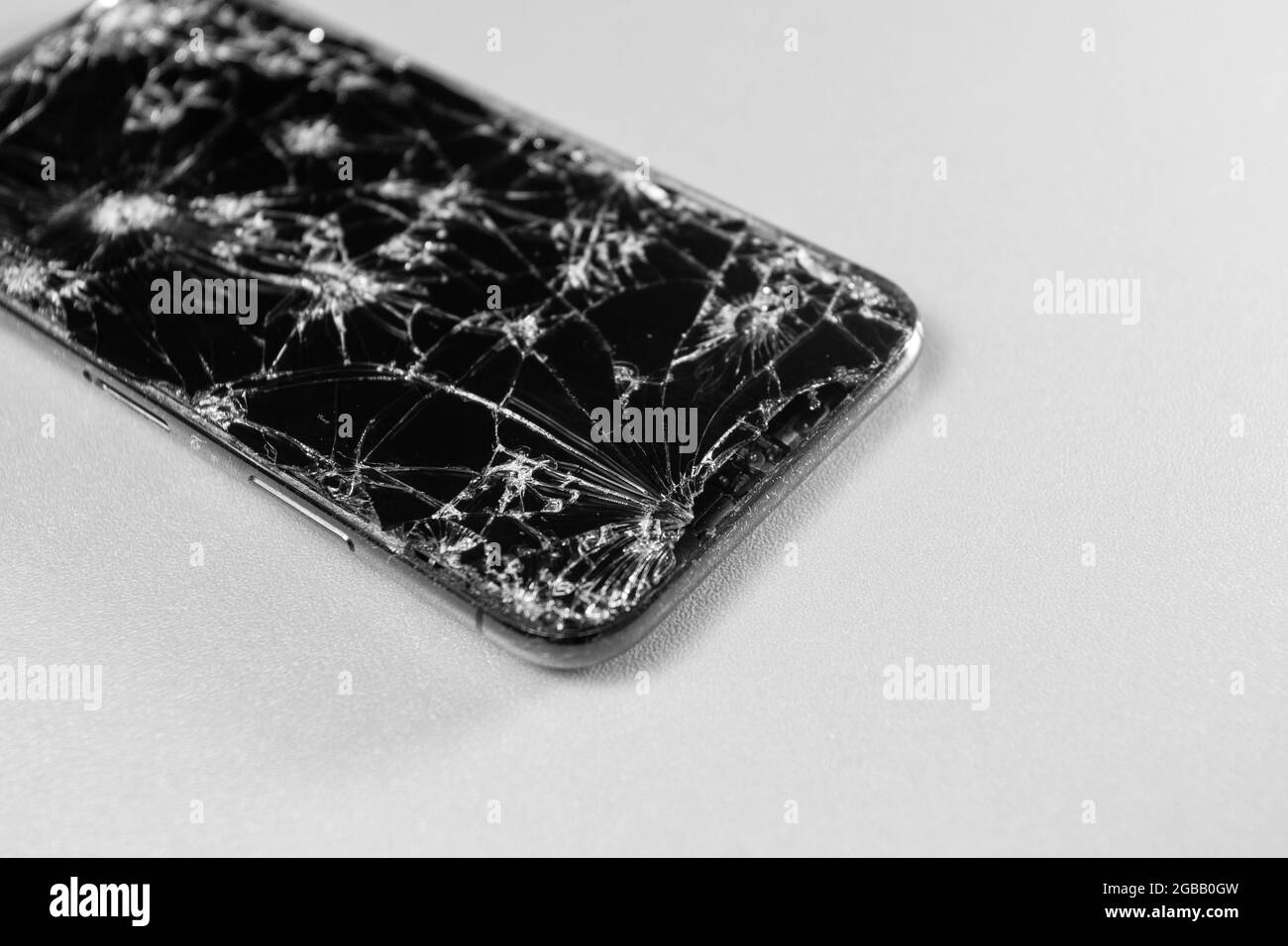 broken mobile phone display on a white background Stock Photo - Alamy