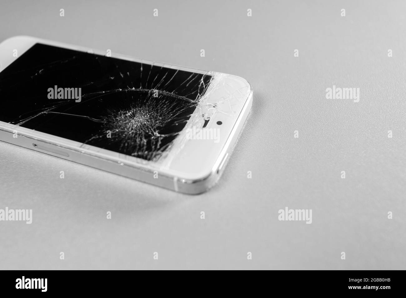 broken mobile phone display on a white background Stock Photo - Alamy
