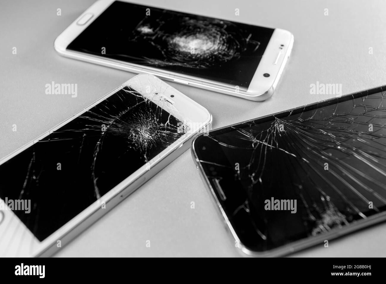 broken mobile phone display on a white background Stock Photo - Alamy