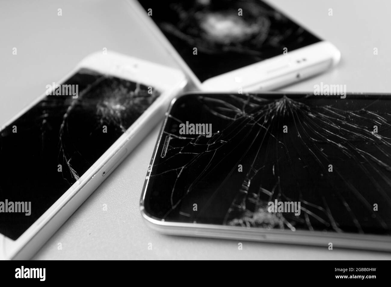 broken mobile phone display on a white background Stock Photo - Alamy