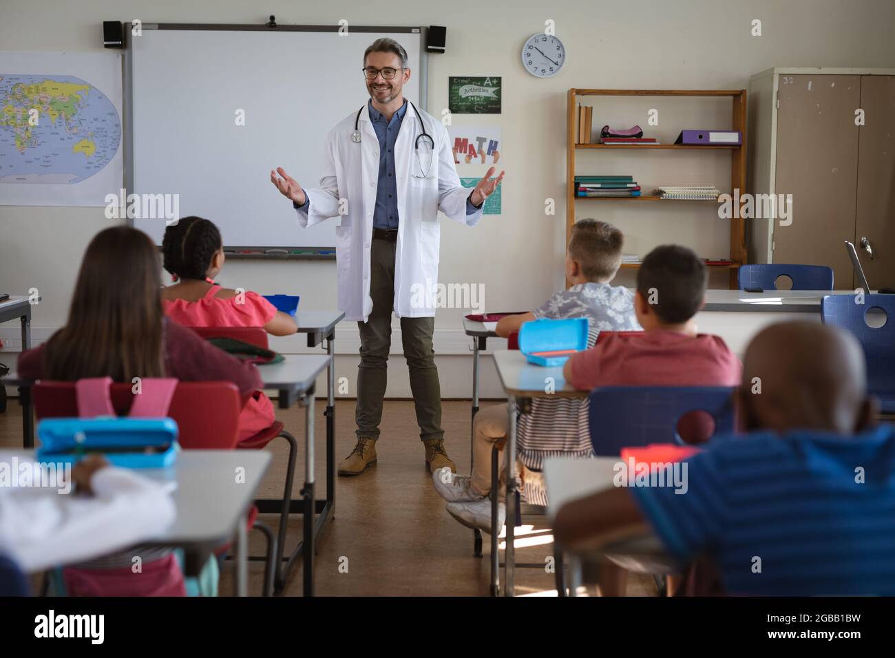 Male college students talking classroom hi-res stock photography and ...