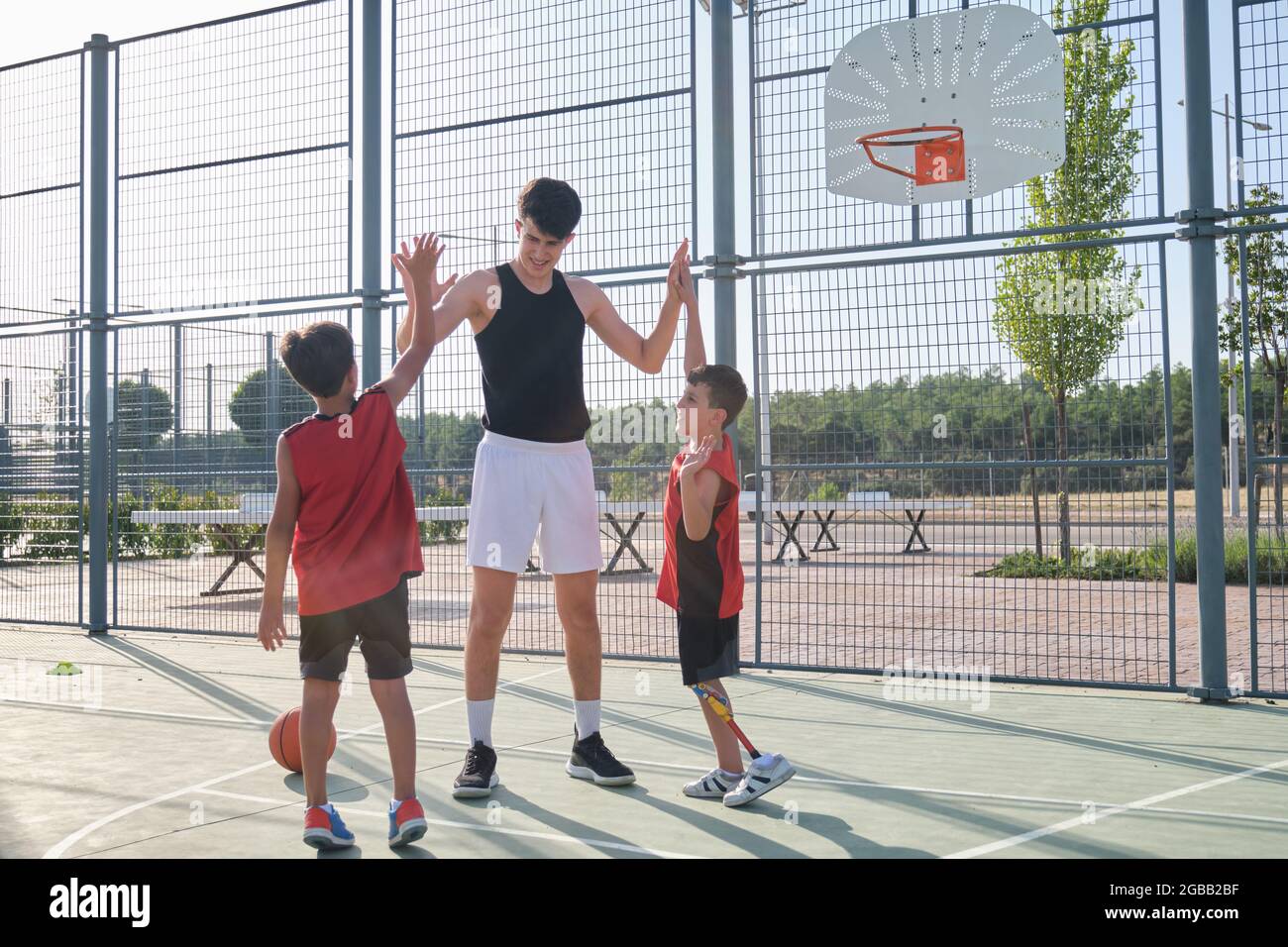 Children high five sport hi-res stock photography and images - Alamy