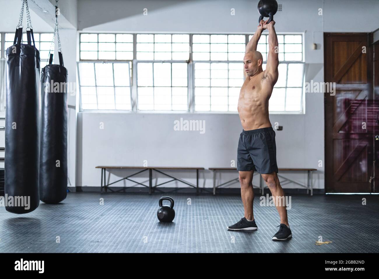People lifting dumbbell weights hi-res stock photography and images - Alamy