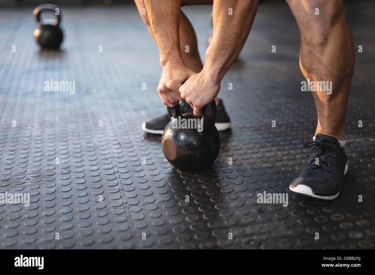 Man lifting weights at gym hi-res stock photography and images - Alamy