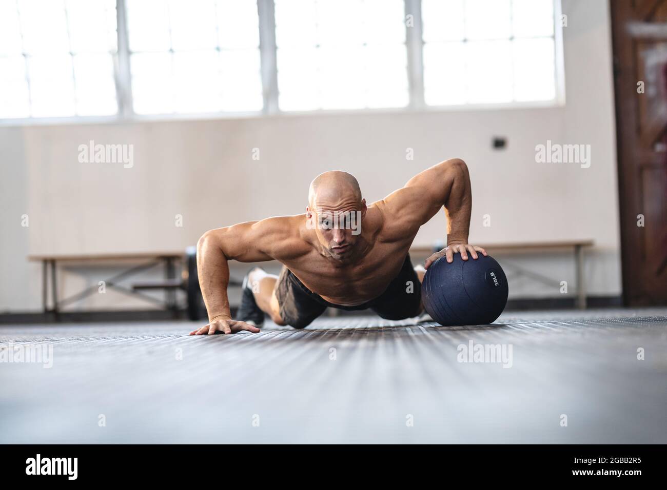 Strong man doing physical exercise hi-res stock photography and images ...