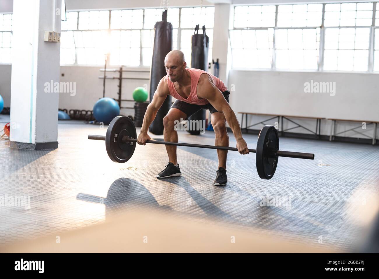 Man lifting weights at gym hi-res stock photography and images - Alamy
