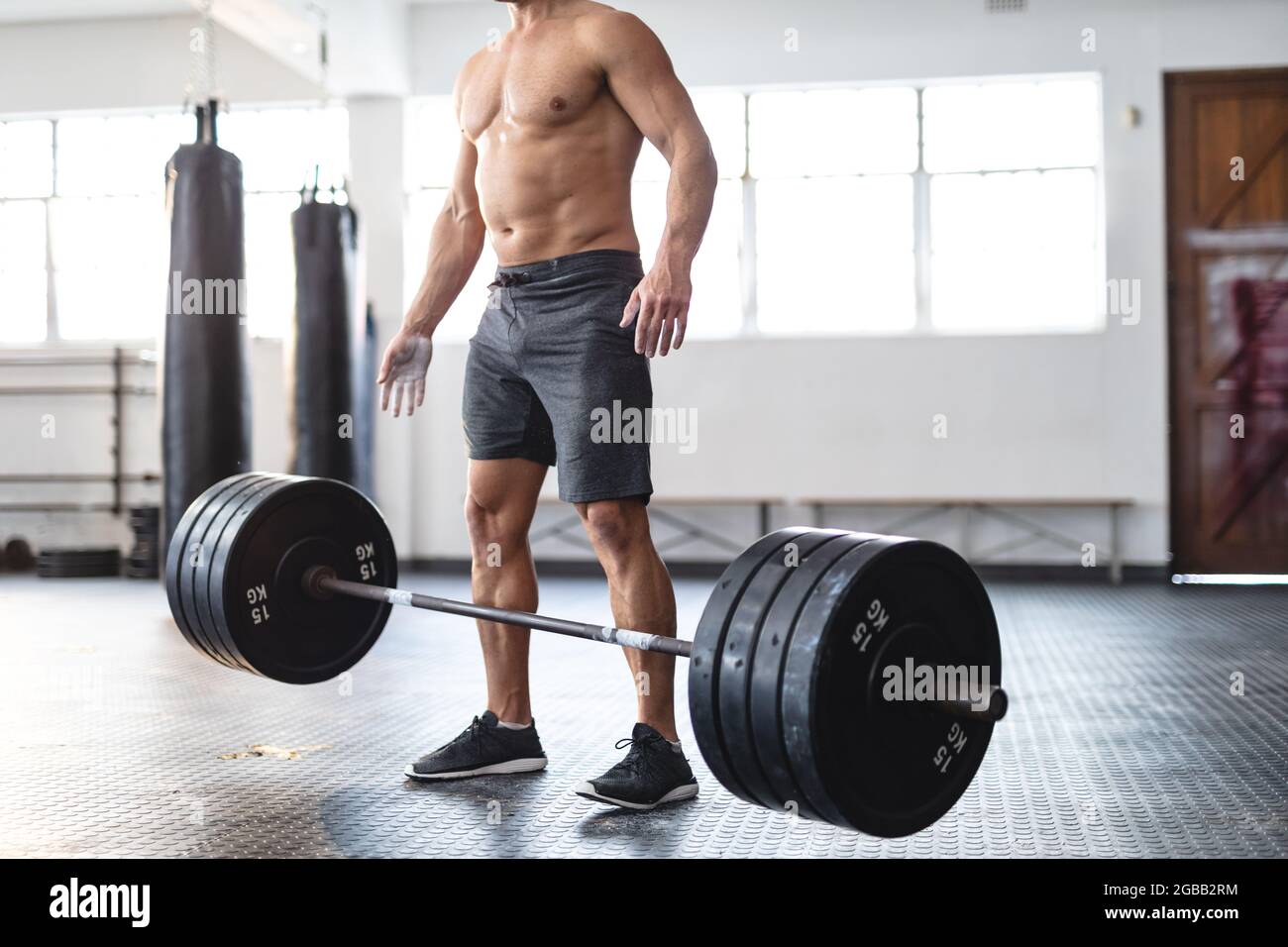 Man lifting weights at gym hi-res stock photography and images - Alamy