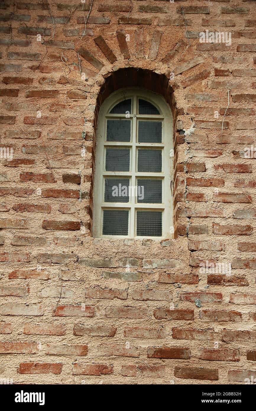 Brick wall background with window Stock Photo - Alamy
