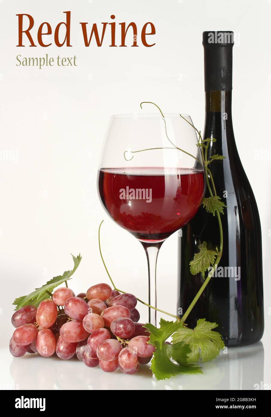Bottle, glass of wine and ripe grapes isolated on white Stock Photo - Alamy