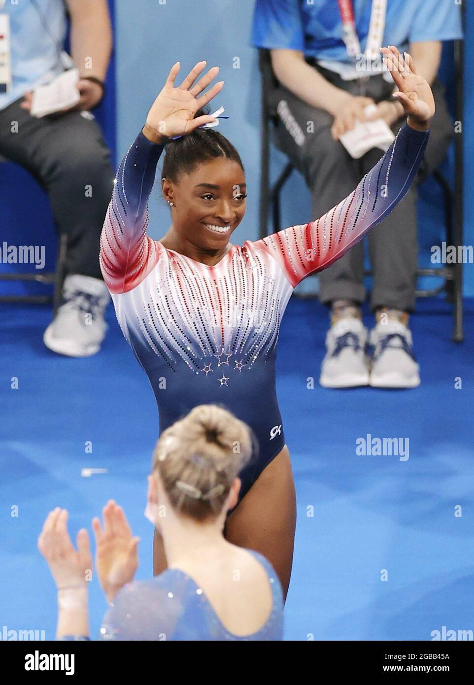 Simone Biles of the United States waves to the stands after competing ...