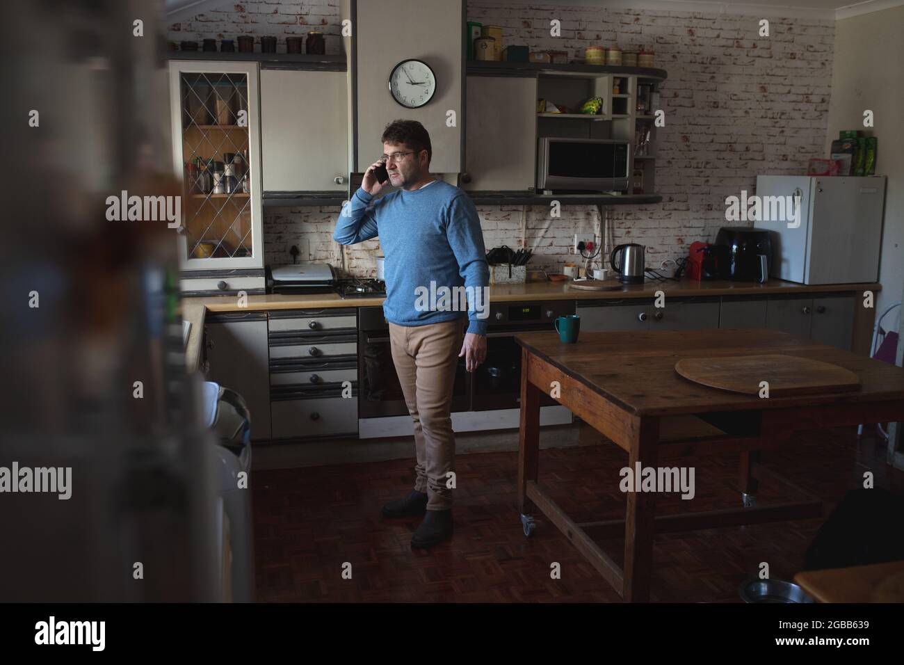 Cook looking out window hi-res stock photography and images - Alamy