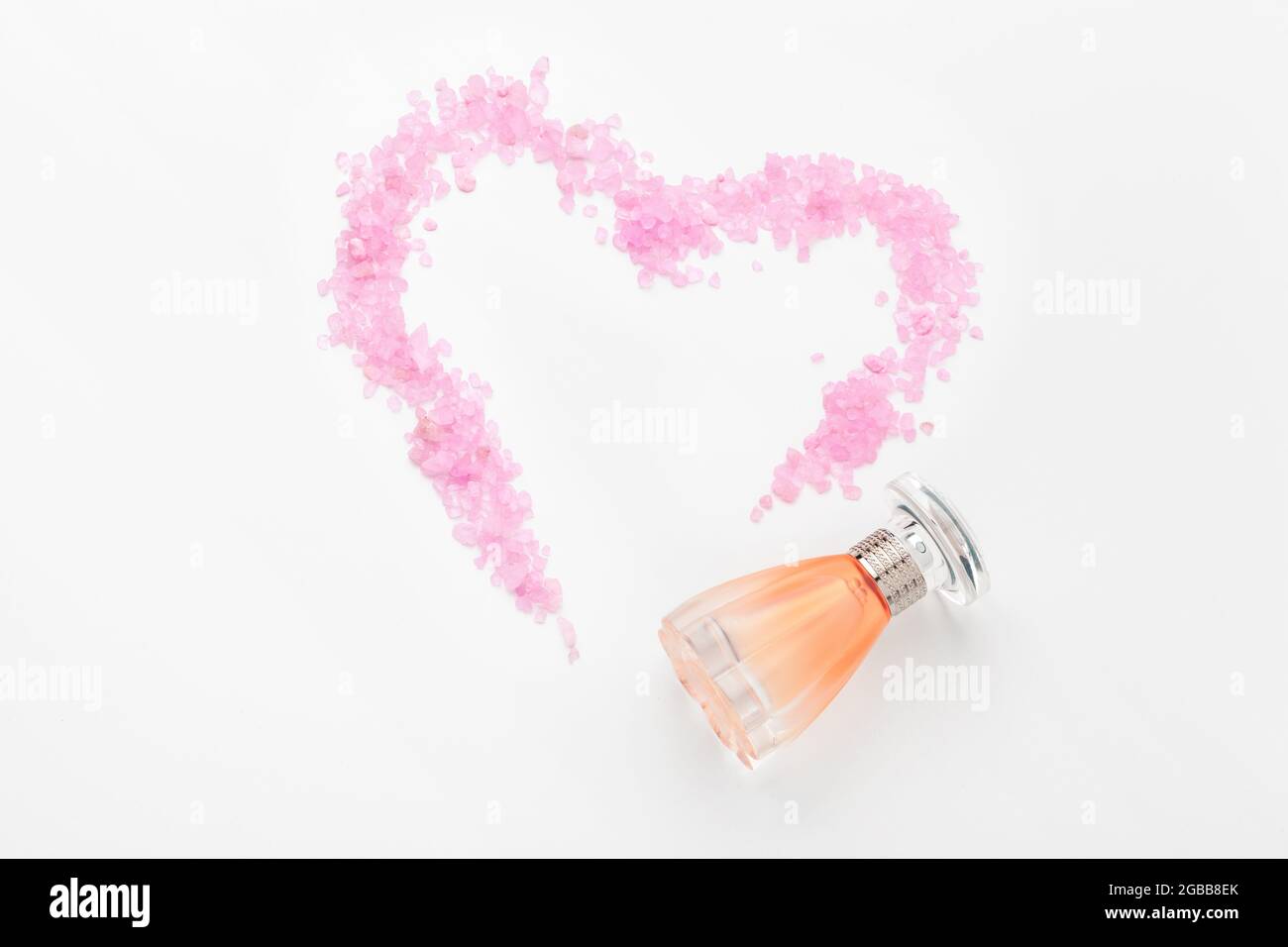 Bottle of perfume with red hearts Stock Photo - Alamy