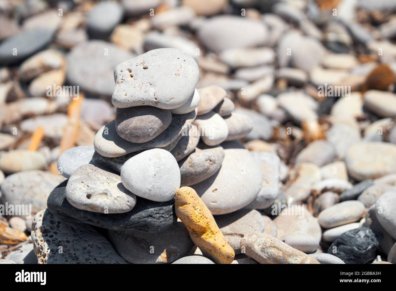 Balanced Pebbles Pyramid on the Beach on a Sunny Day. Meditation ...