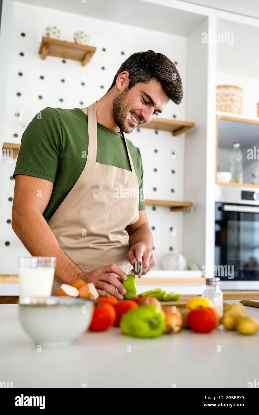 Man cooking in kitchen hi-res stock photography and images - Alamy