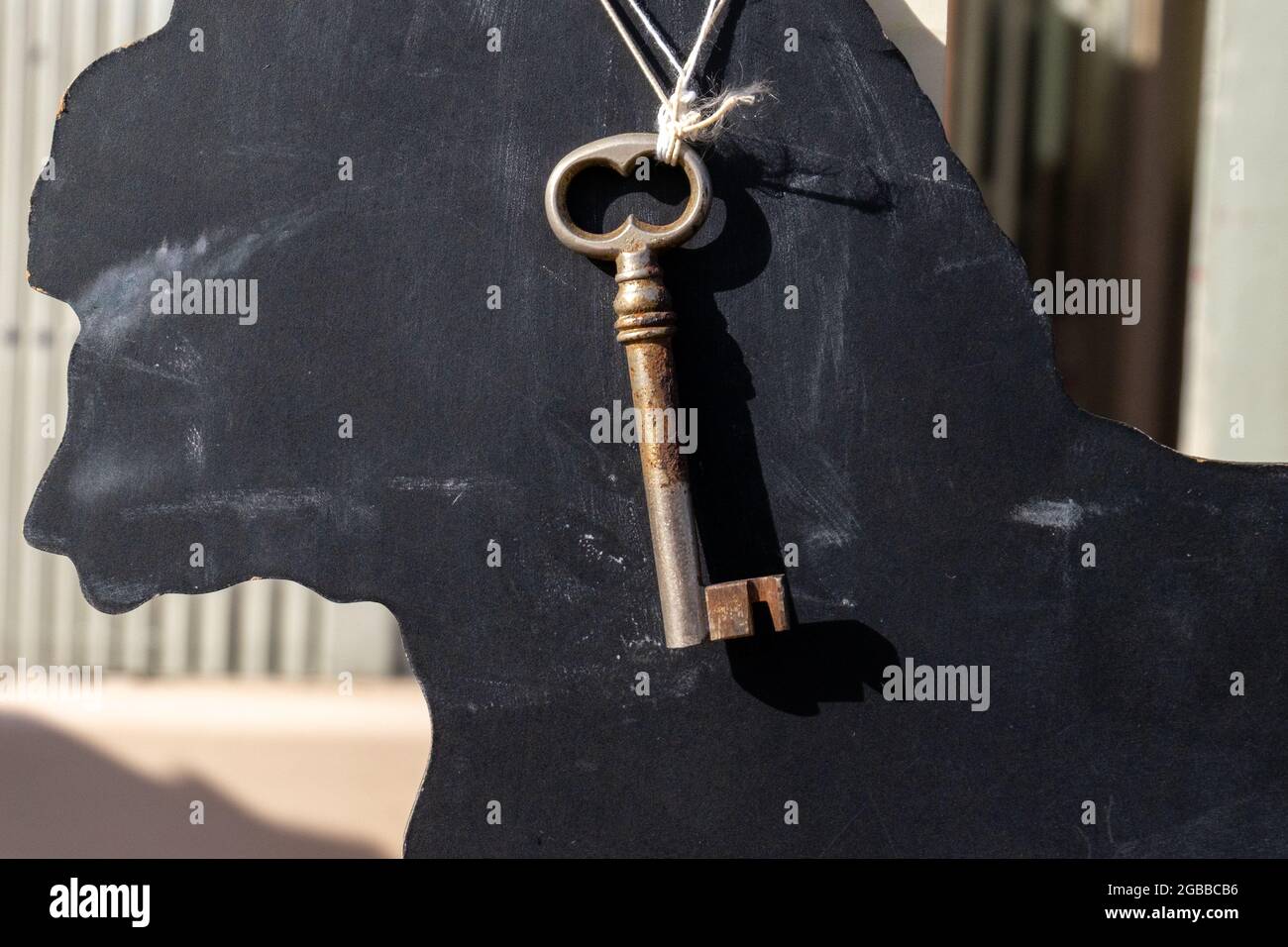 Old key on string Stock Photo - Alamy