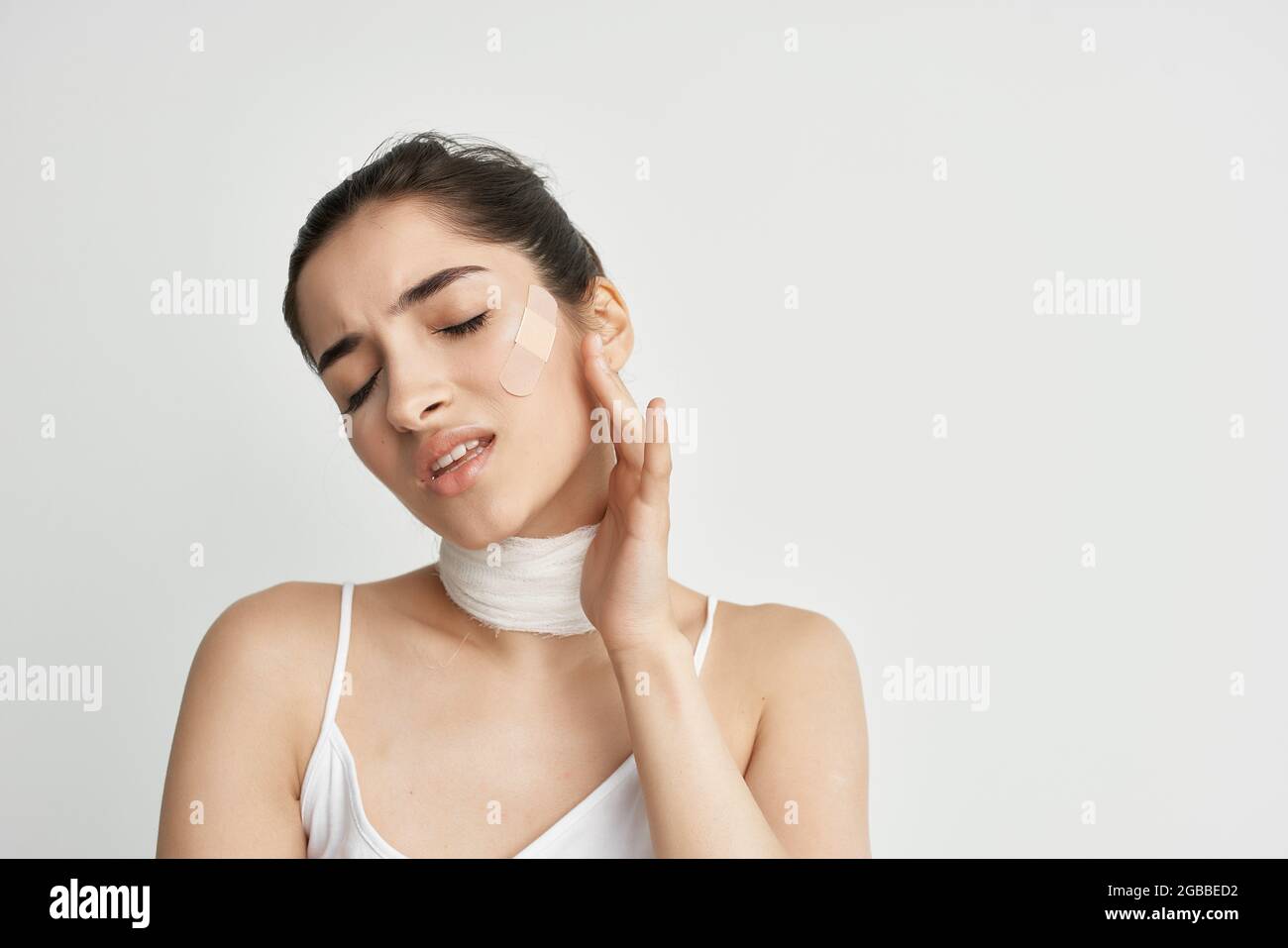 woman with bandage around her neck headache health problems migraine ...