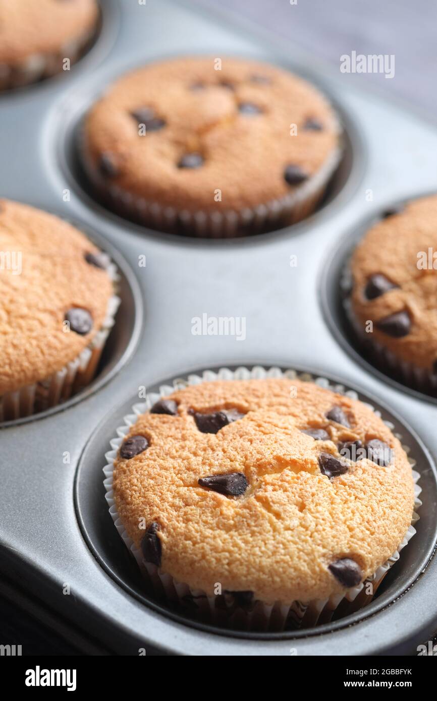 detail shot of muffin and baking tray on table Stock Photo - Alamy